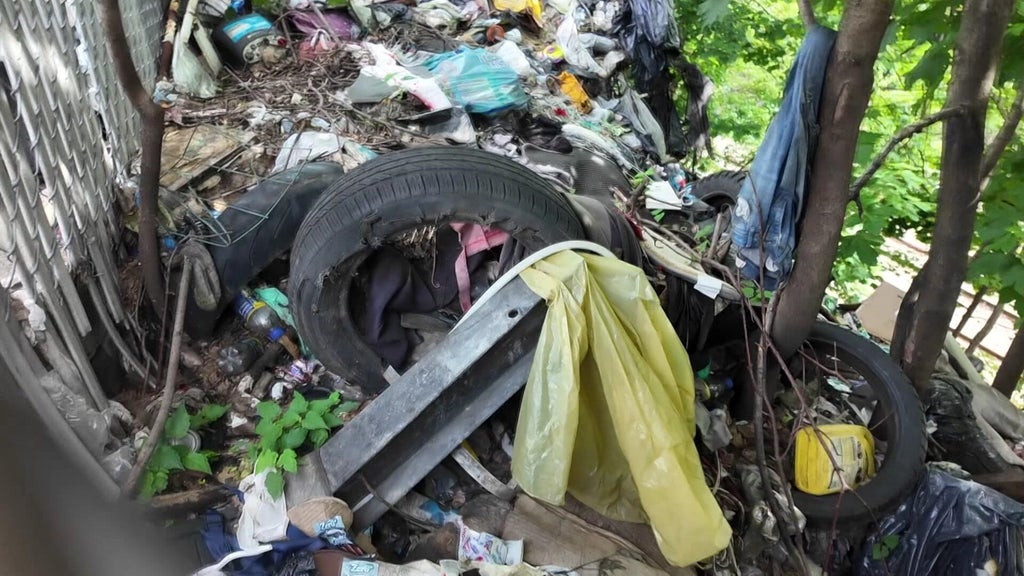 Maspeth residents fed up with piles of garbage along freight train ...