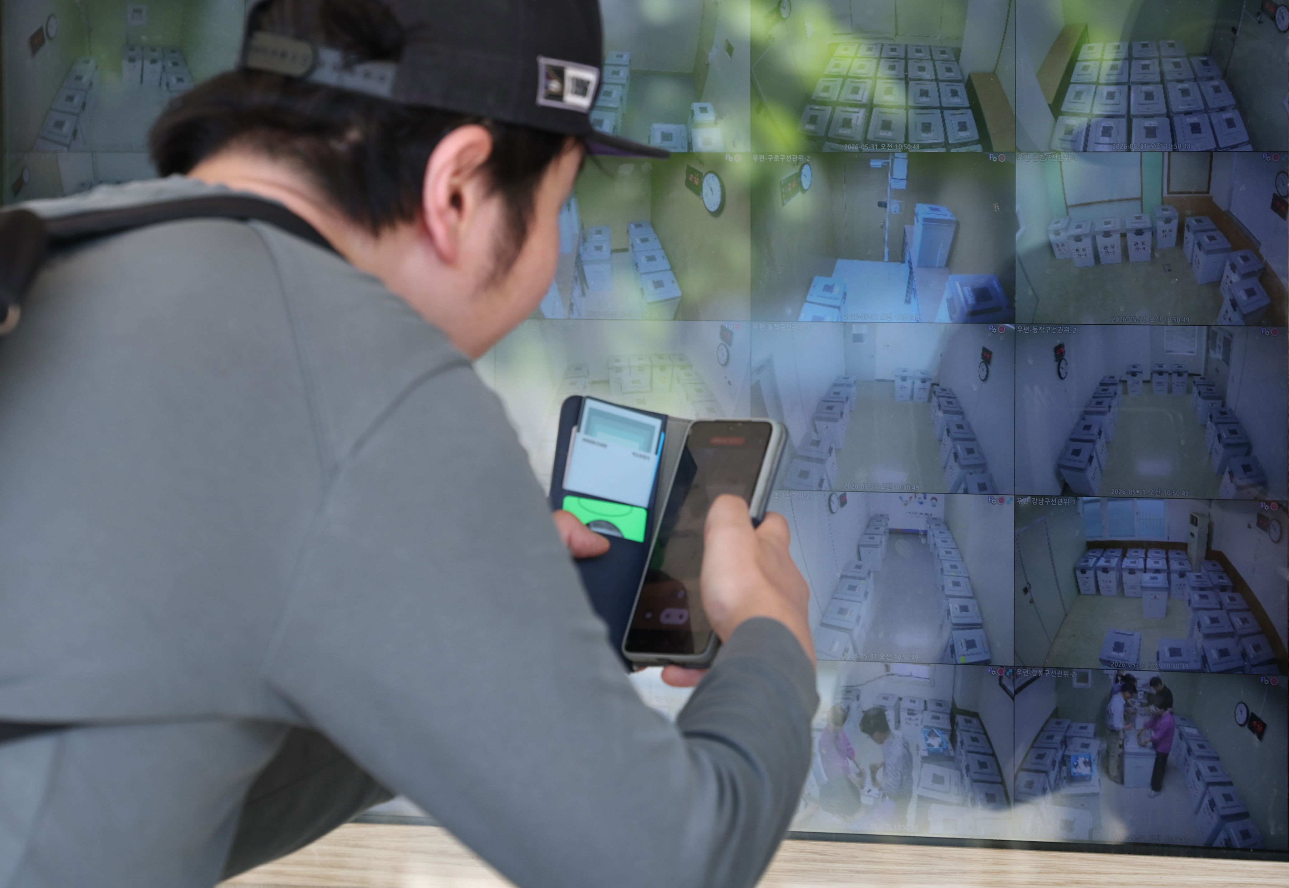 Citizens monitor voting boxes via public CCTV screens