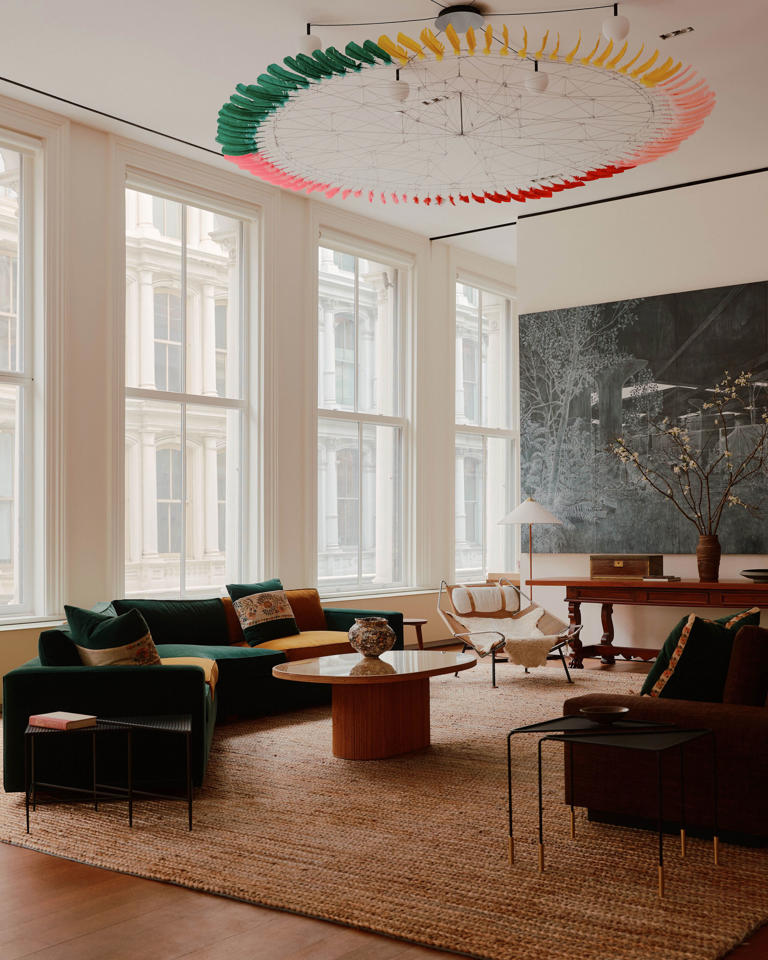 In this historic SoHo loft, a feather ceiling sculpture takes flight