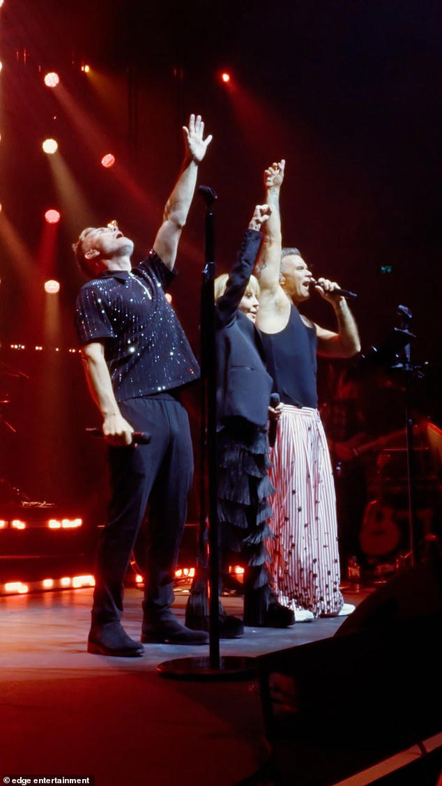 Relight my fire! Lulu reunites with Take That's Robbie Williams and ...