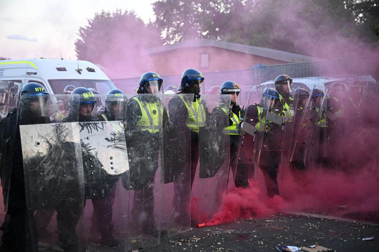 Officers under attack as flares and flaming wheelie bins pelted in ...