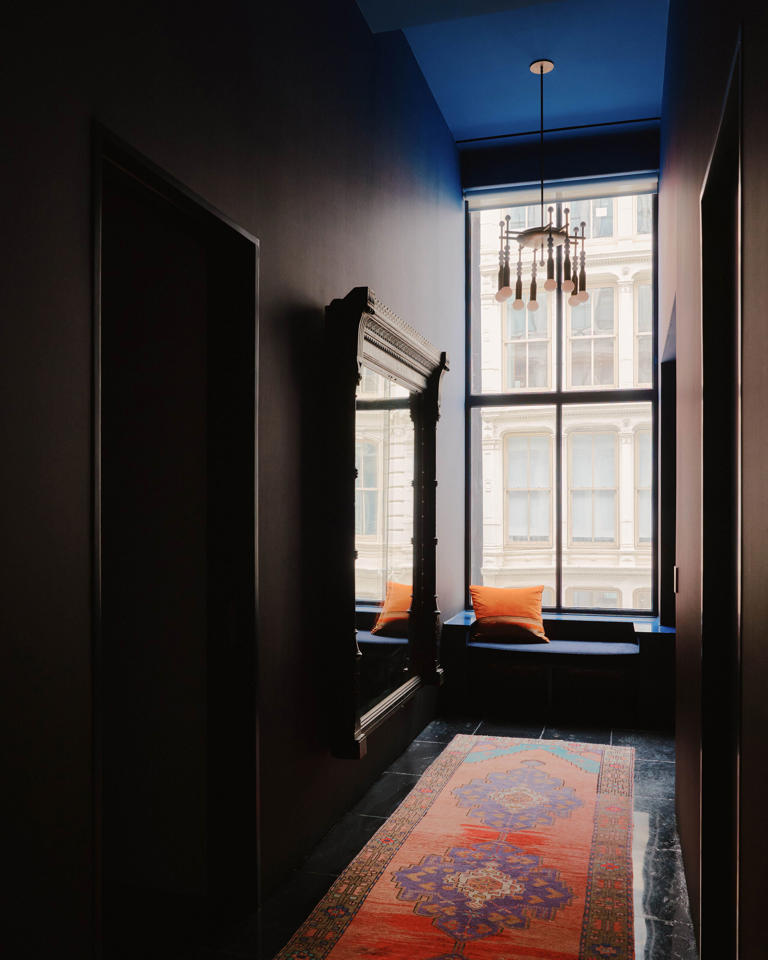 In this historic SoHo loft, a feather ceiling sculpture takes flight