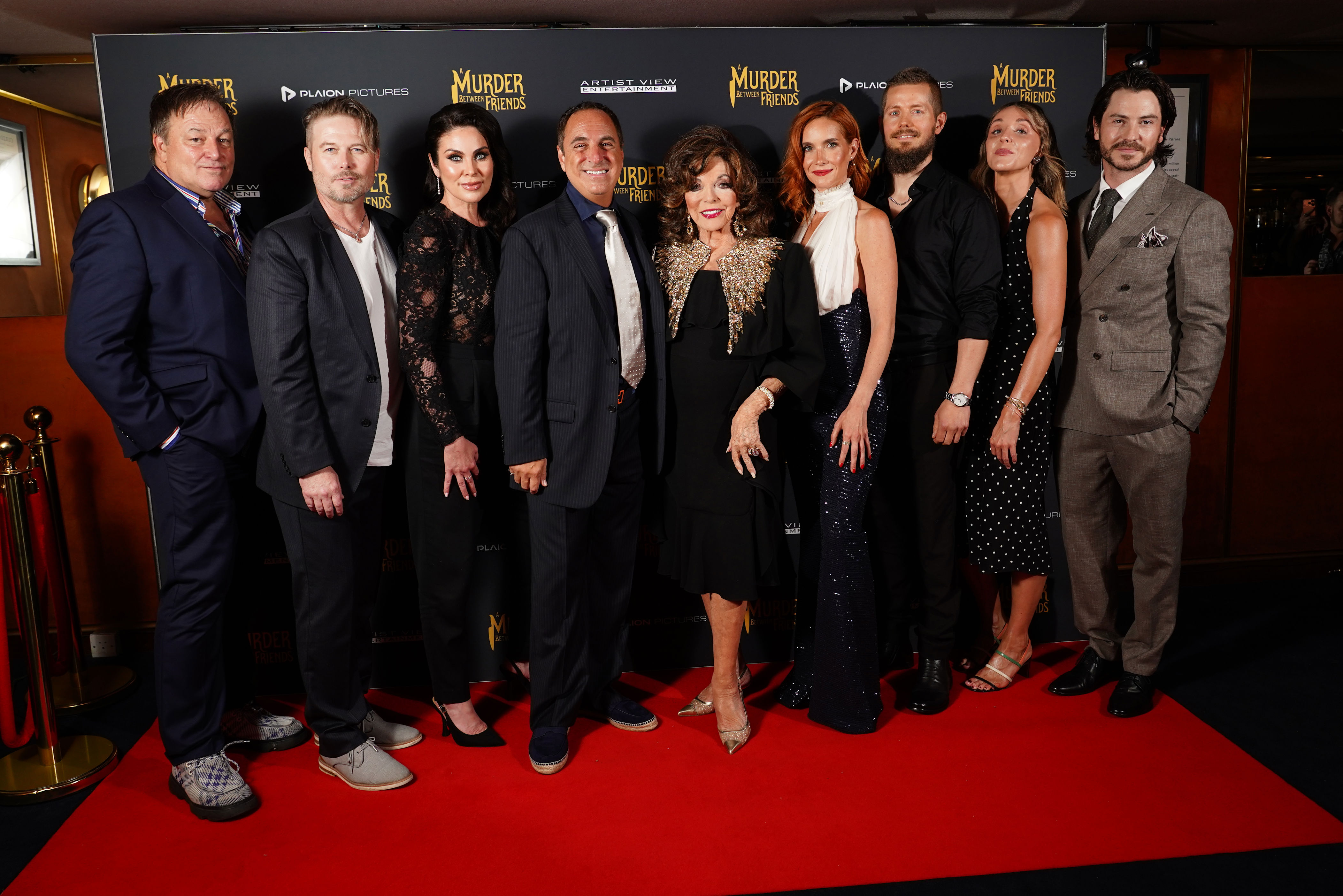 Dame Joan Collins reunites with Elizabeth Hurley on red carpet