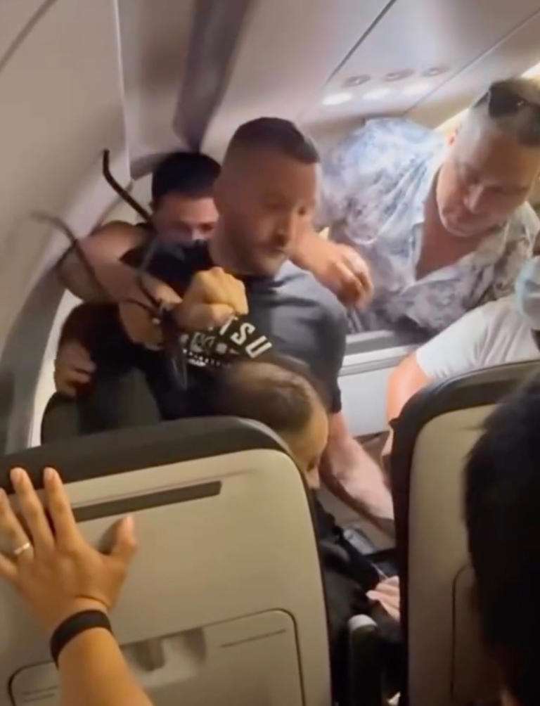 Deranged Frontier Airlines passenger tries to jump out of plane mid ...