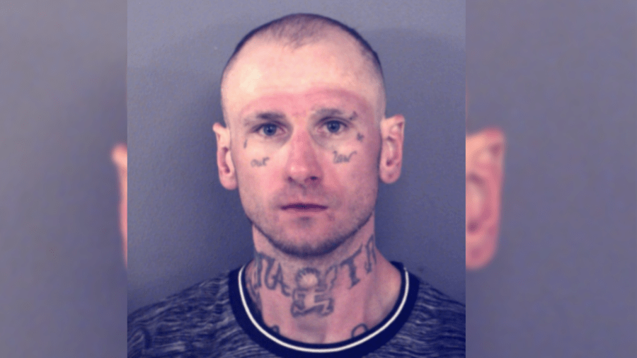 Disturbance call leads to arrest of man on parole violation warrant