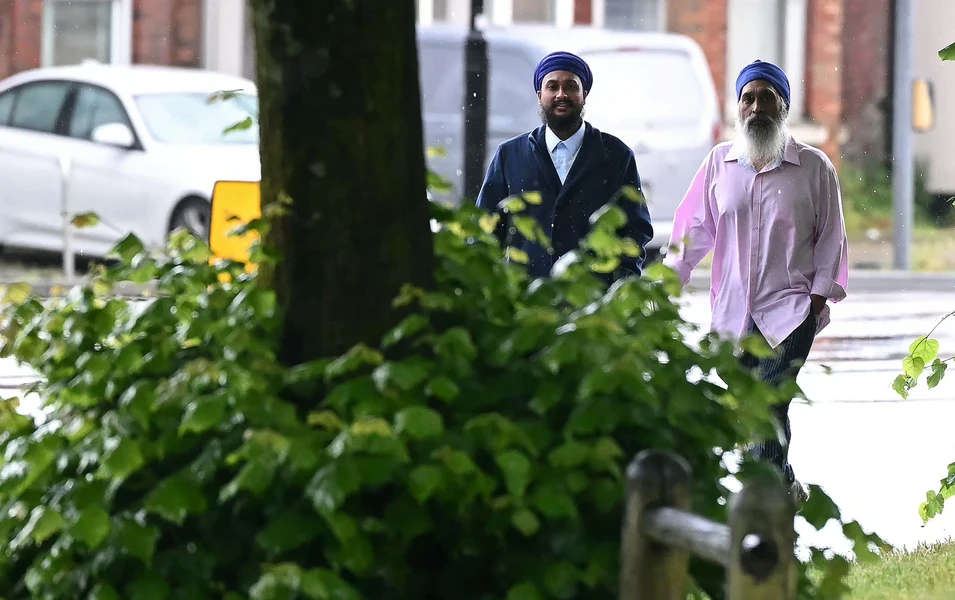 Convicted killer and family face 22 weapons charges