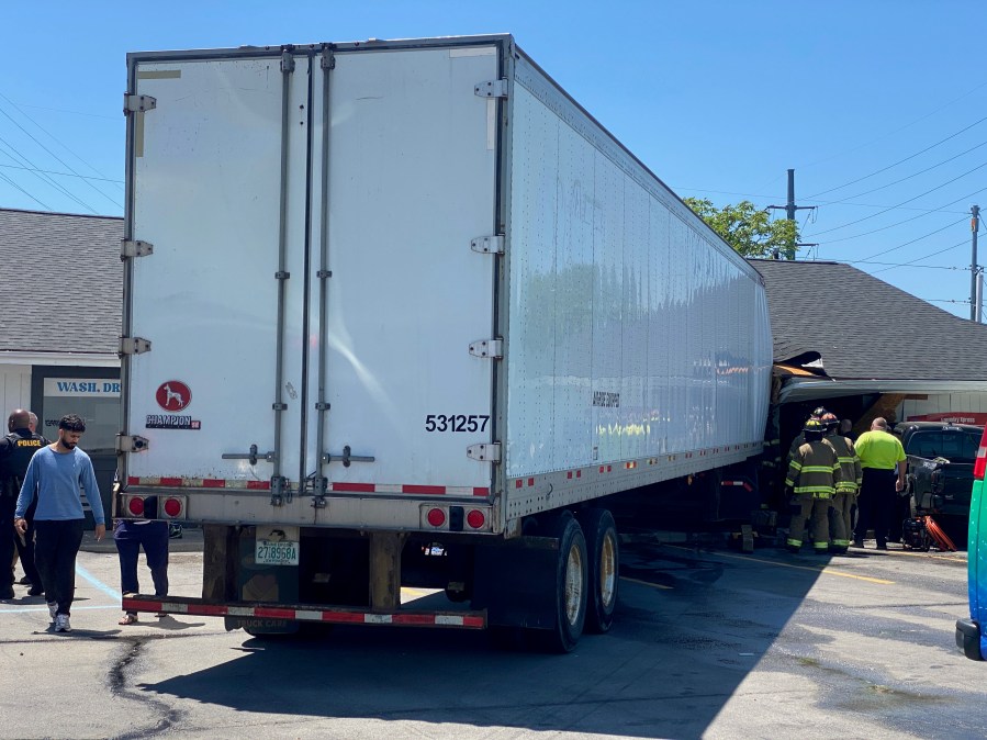 Truck hits building on West Jefferson, disrupts traffic