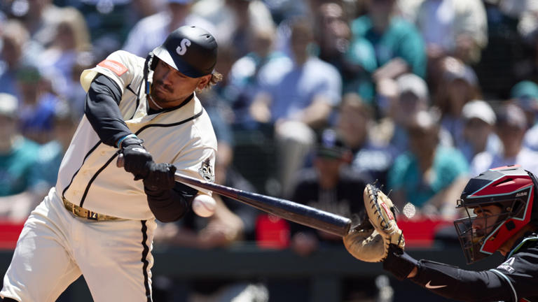 Mariners slugger Josh Naylor leaves game with back spasms after hitting ...
