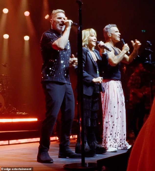 Relight my fire! Lulu reunites with Take That's Robbie Williams and ...