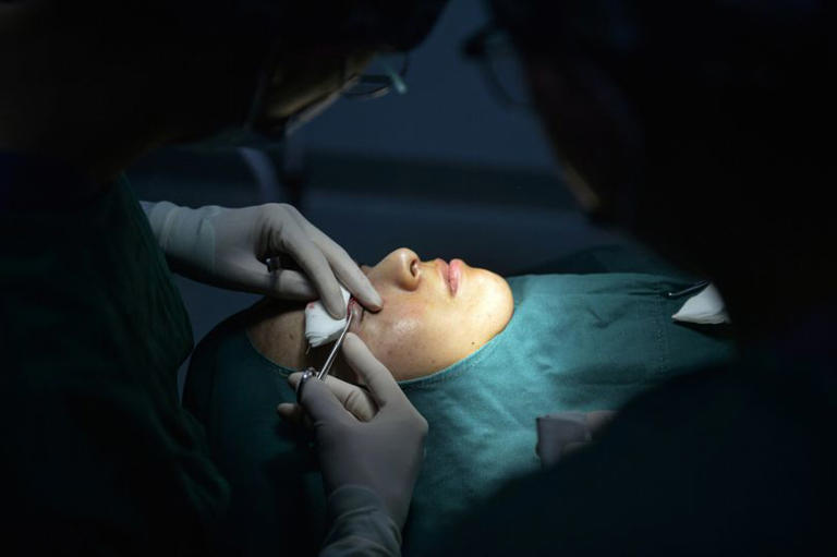 Woman forced to sleep with eyes open after plastic surgery goes ...