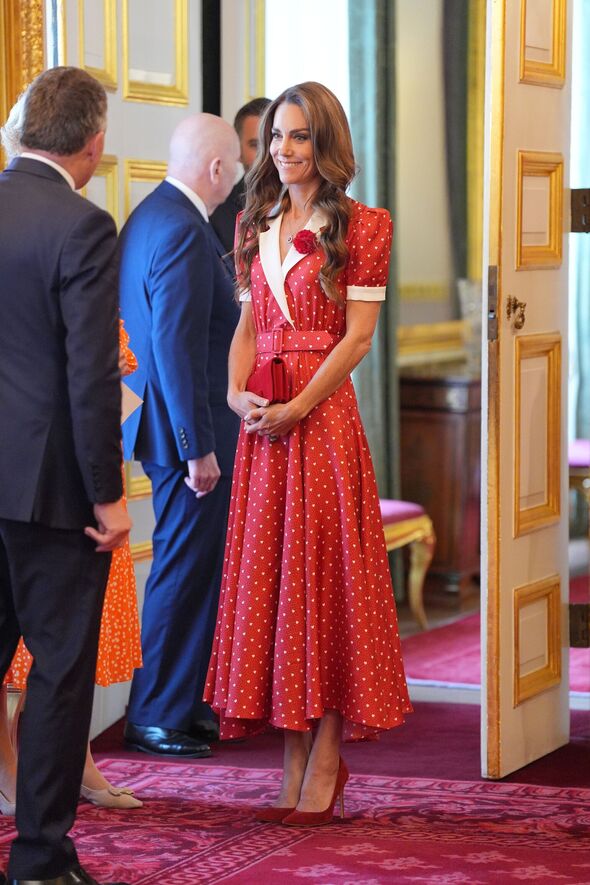 Princess Kate beams in red as she joins King and Queen at cancer reception