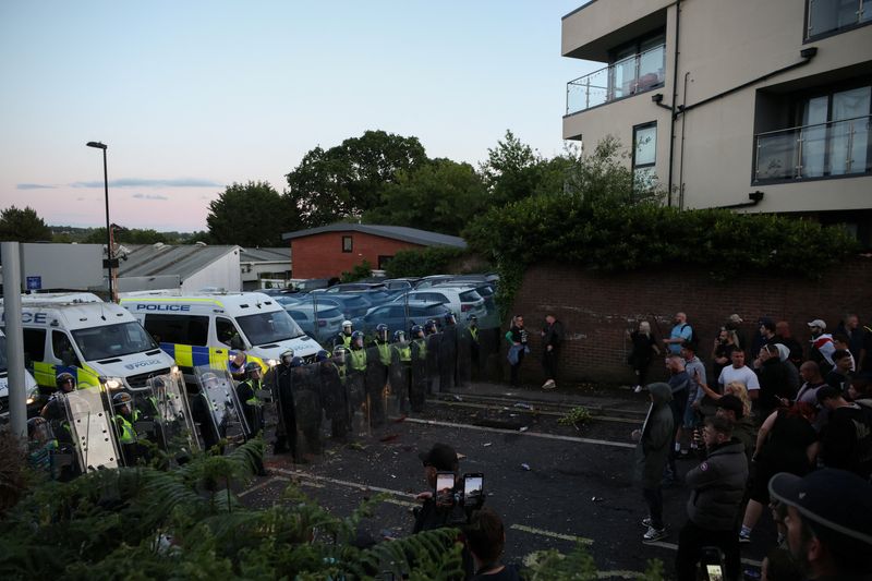 UK police under pressure after dying student was handcuffed