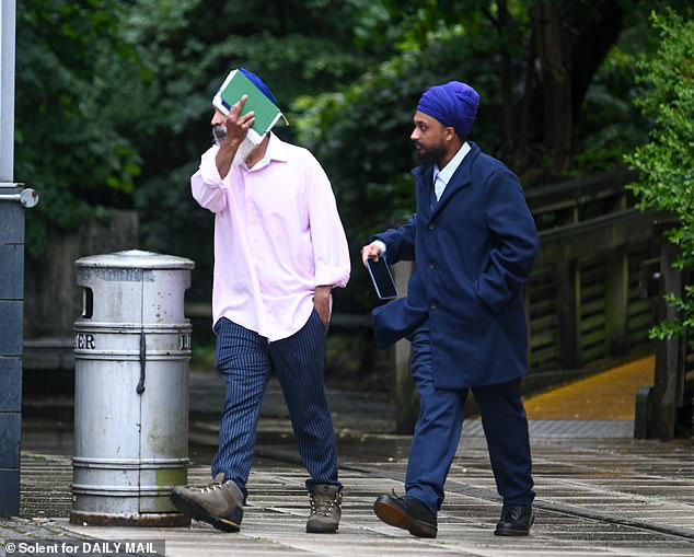 Father of Sikh killer hides face as he and son appear in court charged ...