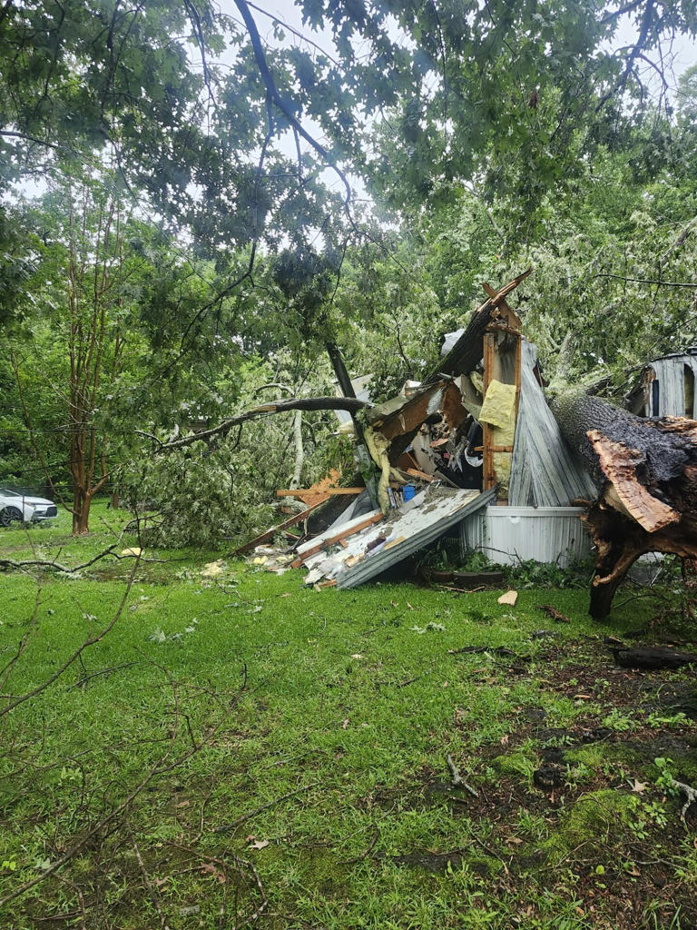 Downed trees block roads, damage homes and cars after storm sweeps ...