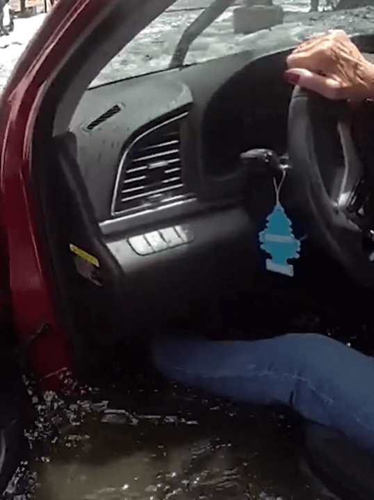 Woman rescued after driving into hidden flood in Aurora