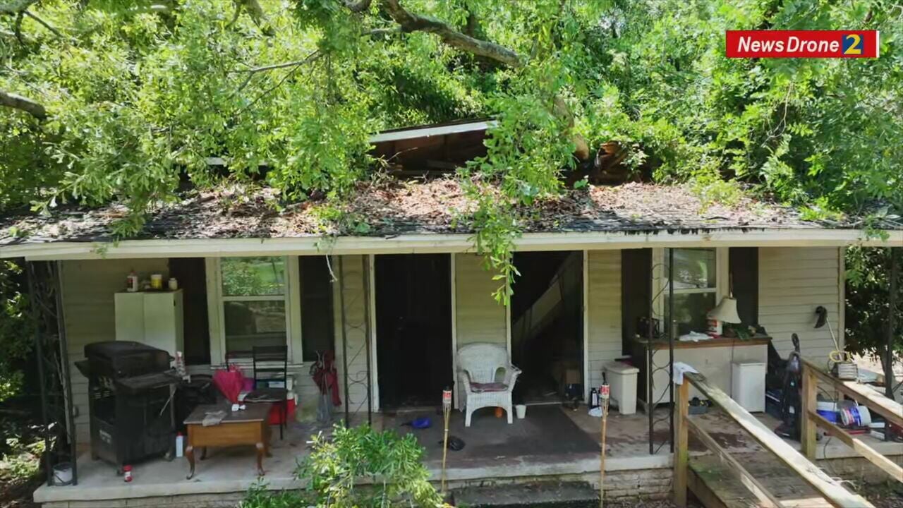 Man rescues trapped younger brother after tree crashes onto house