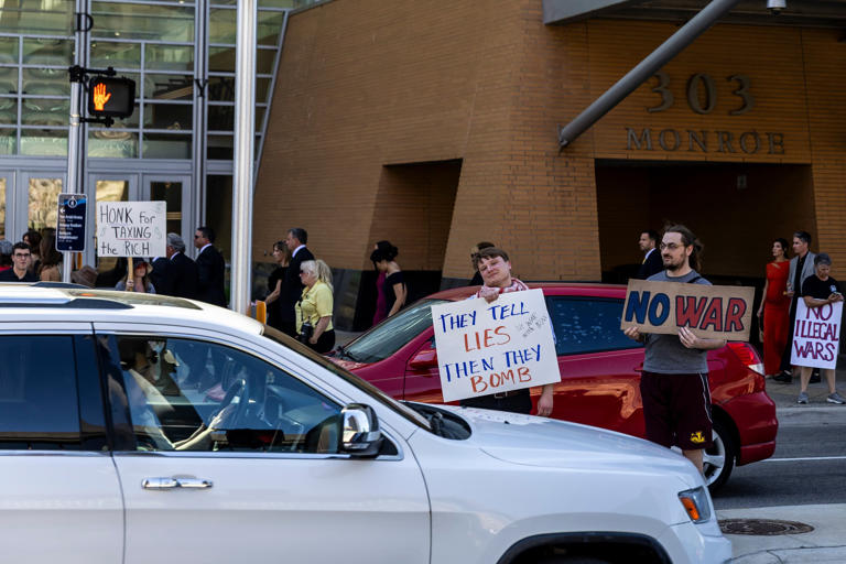Dozens protest outside DeVos Place during Economic Club event featuring ...