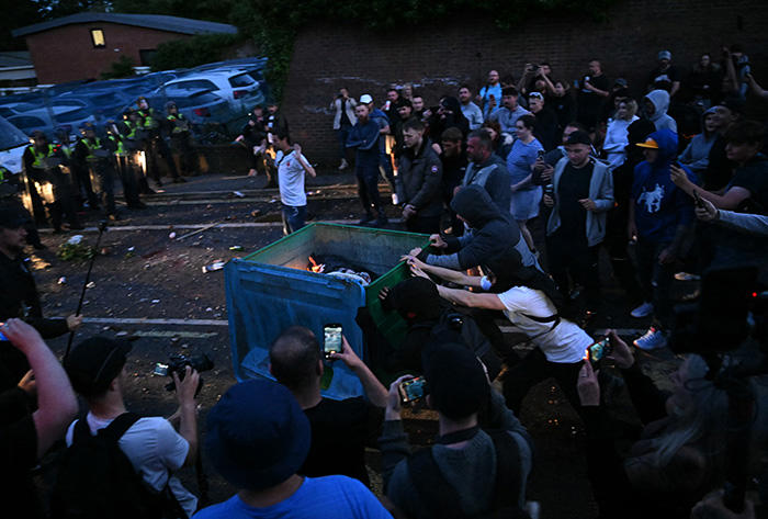 'I can't breathe': Clashes erupt after UK police handcuff dying student