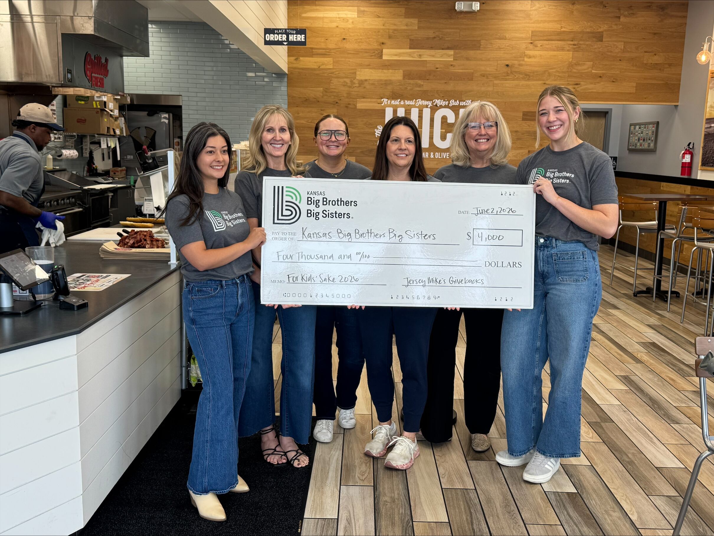 Jersey Mike’s makes donation to Kansas Big Brothers Big Sisters