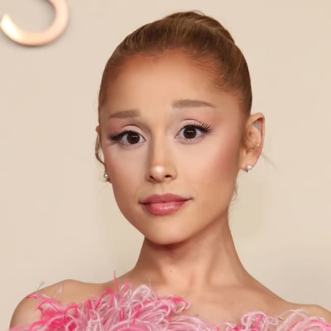 Ariana Grande rocks a belted yellow dress for new music video