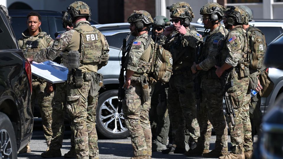 Two hostages released amid hourslong standoff with man barricaded ...