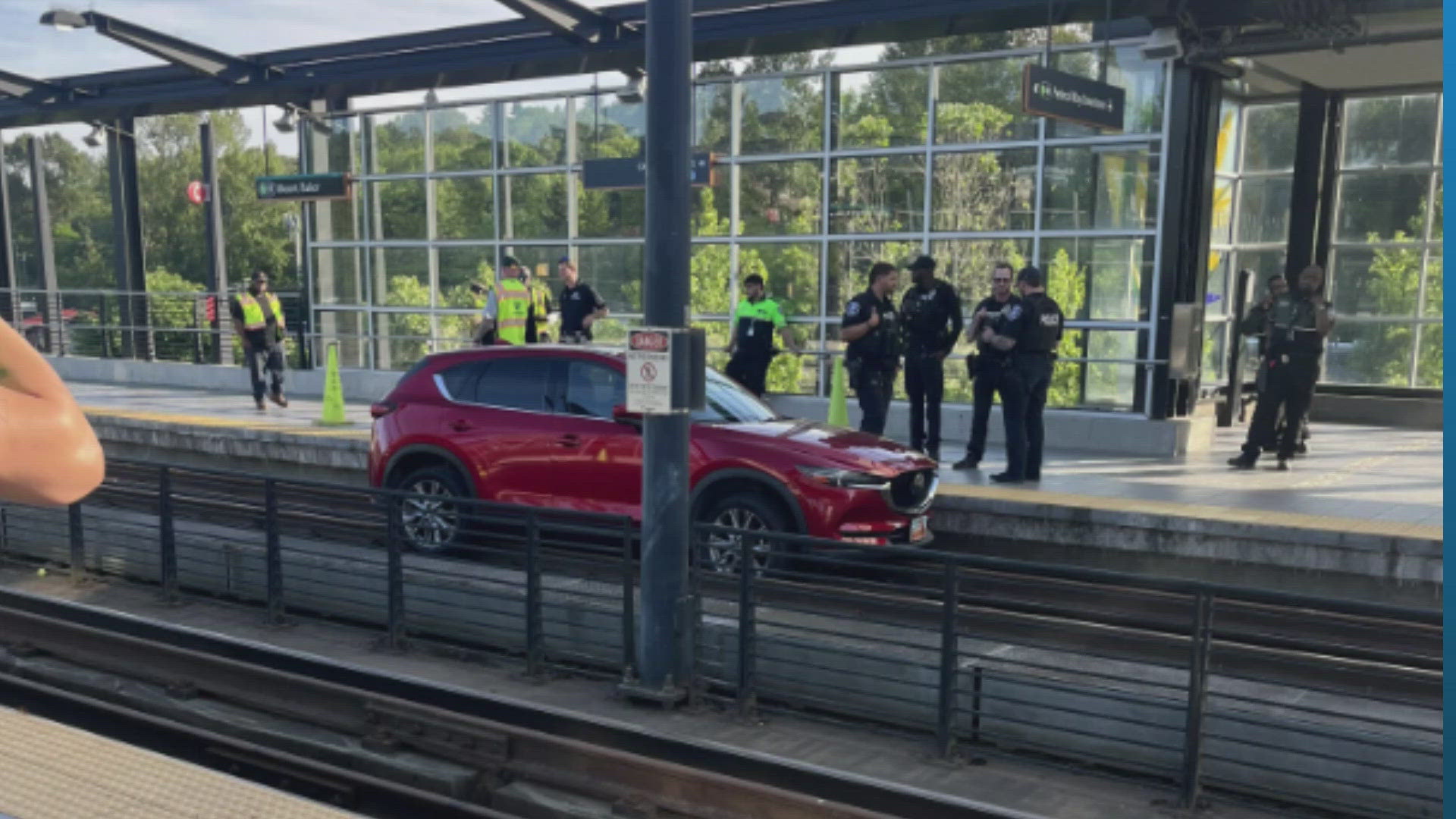 Car drives onto light rail tracks in Seattle