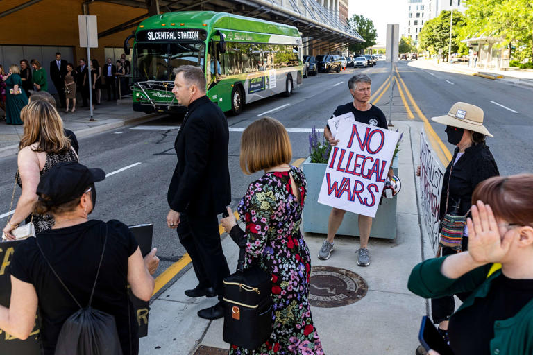 Dozens protest outside DeVos Place during Economic Club event featuring ...