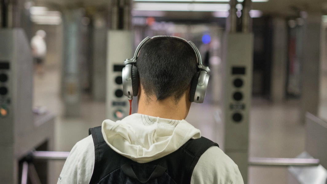 Experts link constant audio use to lost focus and social disconnection