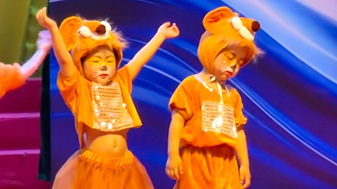 Adorable moment sleepy child struggles to stay awake during performance