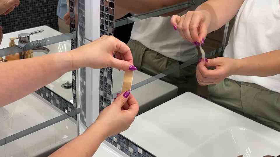 Be careful with hotel mirrors: spot a two-way mirror with a Band-Aid fast