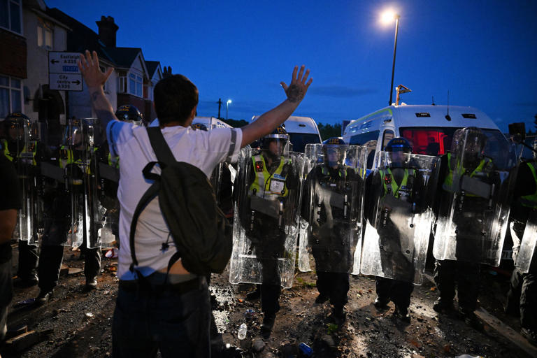 Henry Nowak protesters hurl bricks at police in violent clashes