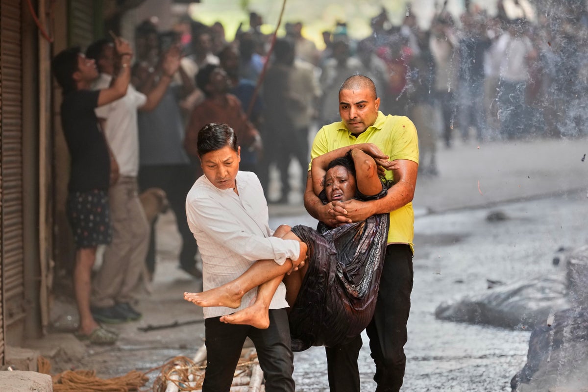 Photos show a rescue operation in a New Delhi hotel fire