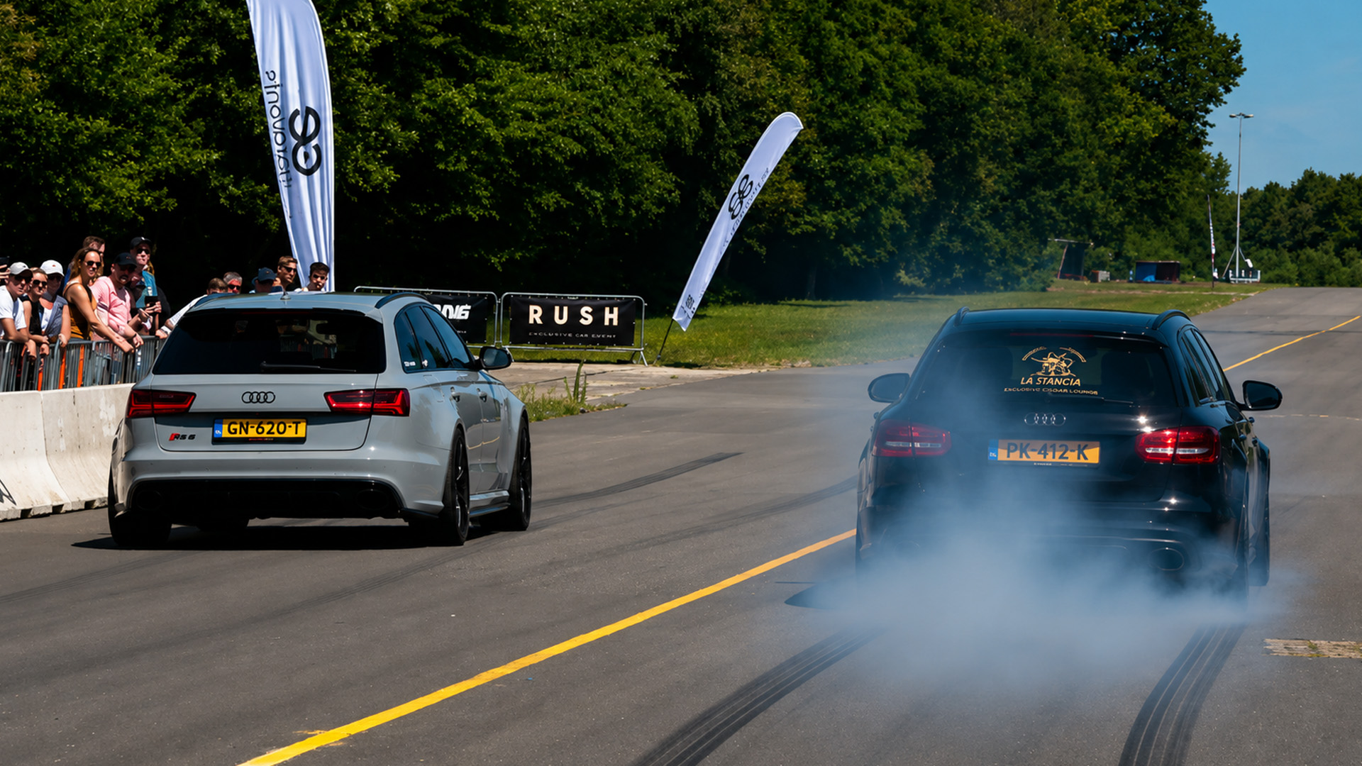 Audi RS6 drag race starts with heavy smoke burnout