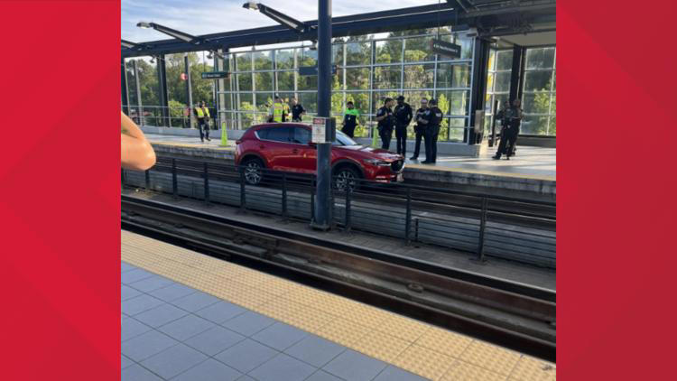 Car drives onto elevated light rail tracks in Seattle