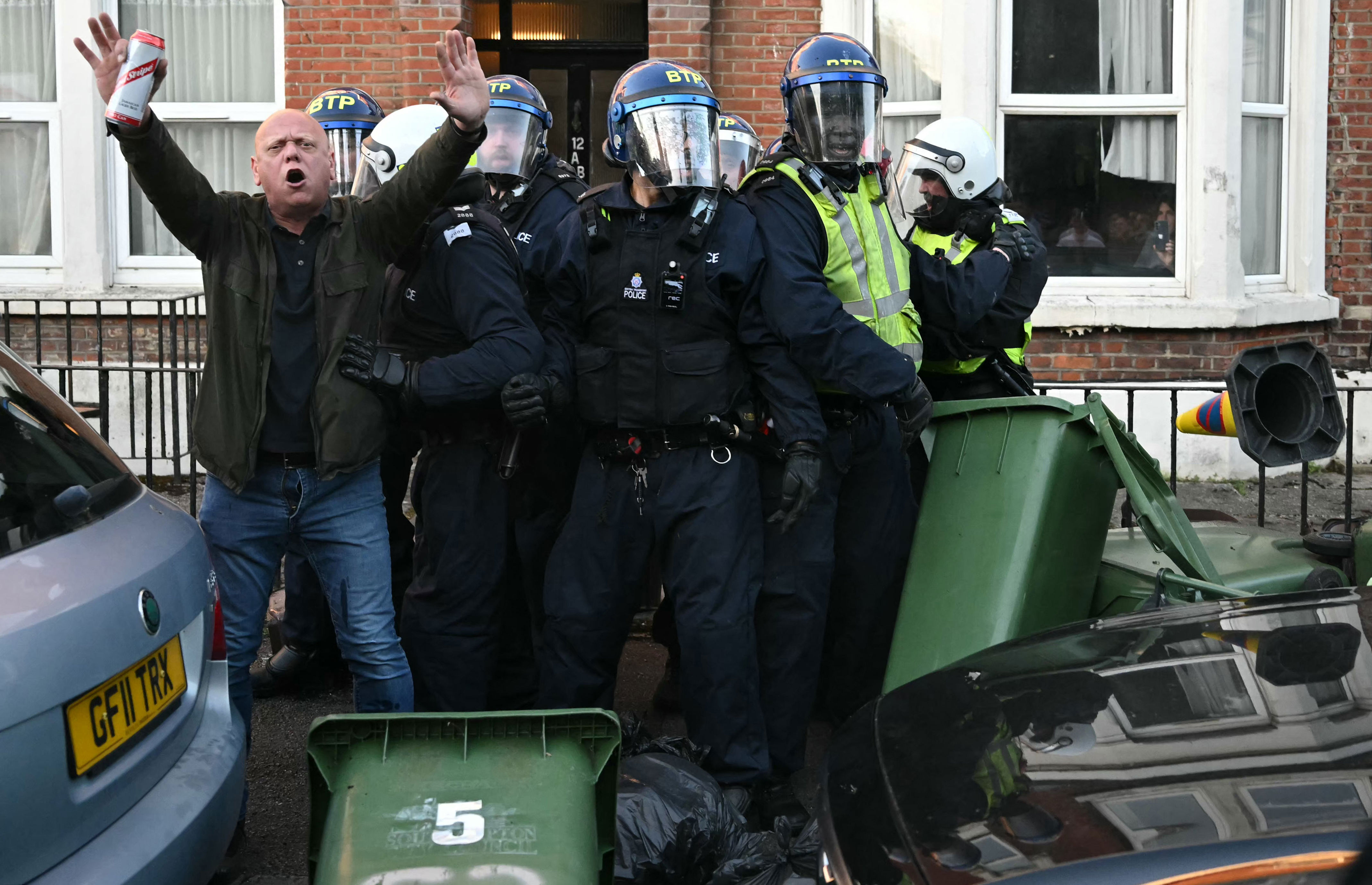 Henry Nowak protesters hurl bricks at police in violent clashes