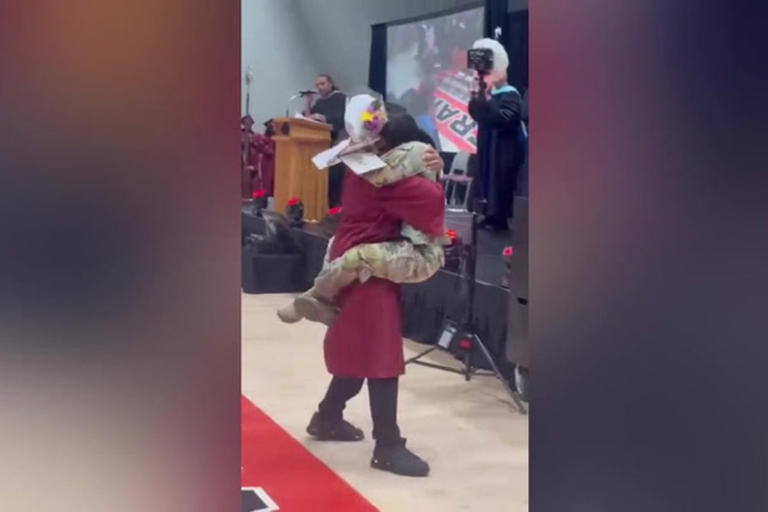 Student surprised at graduation by sister who was overseas for a year