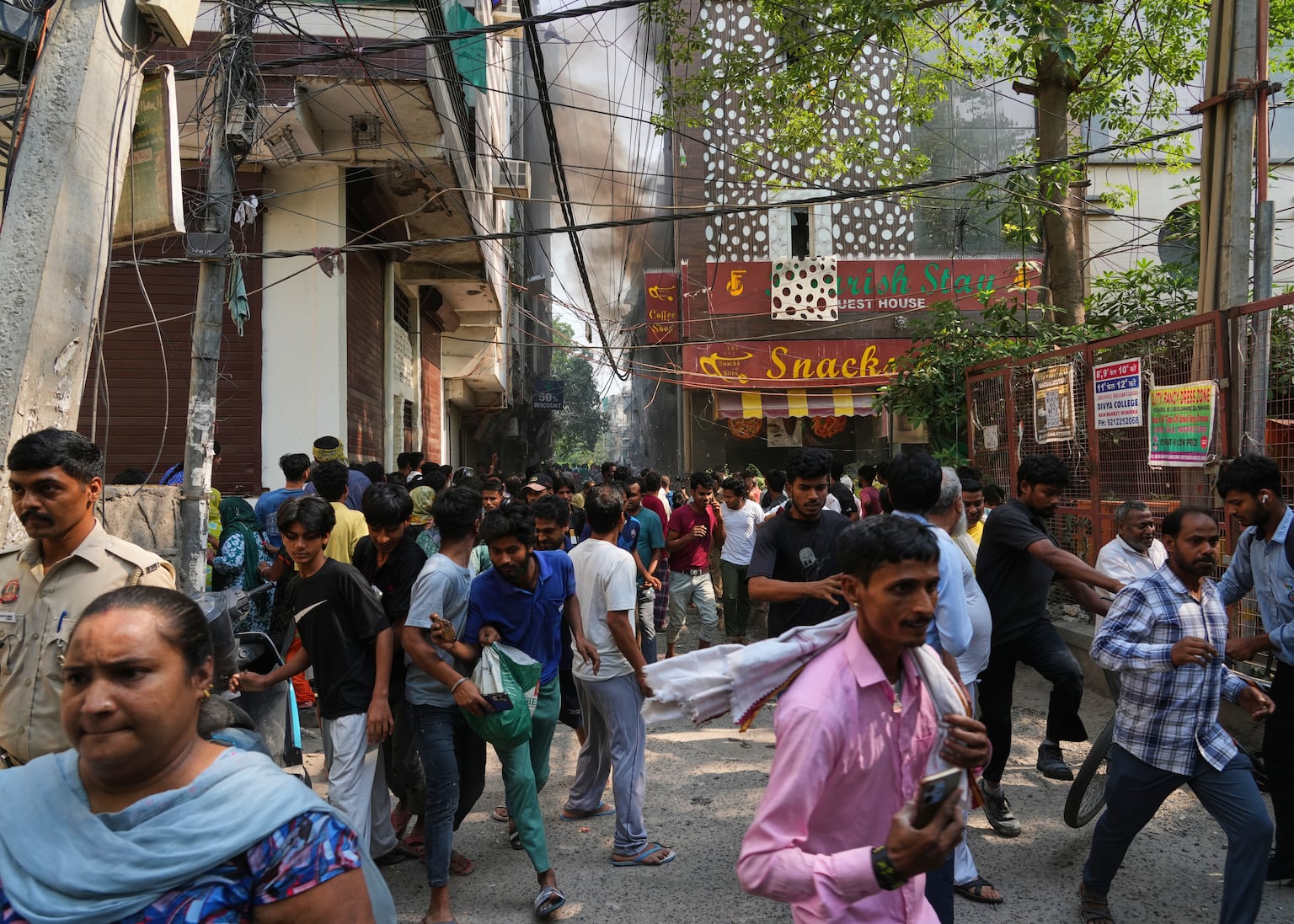 At least 18 people killed as fire sweeps through building in New Delhi