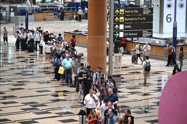 Police recall plane to Changi Airport gate, arrest 3 Chinese nationals ...