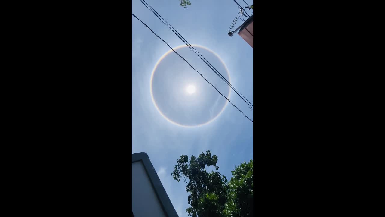 Rare sun halo shines over homes in the Philippines
