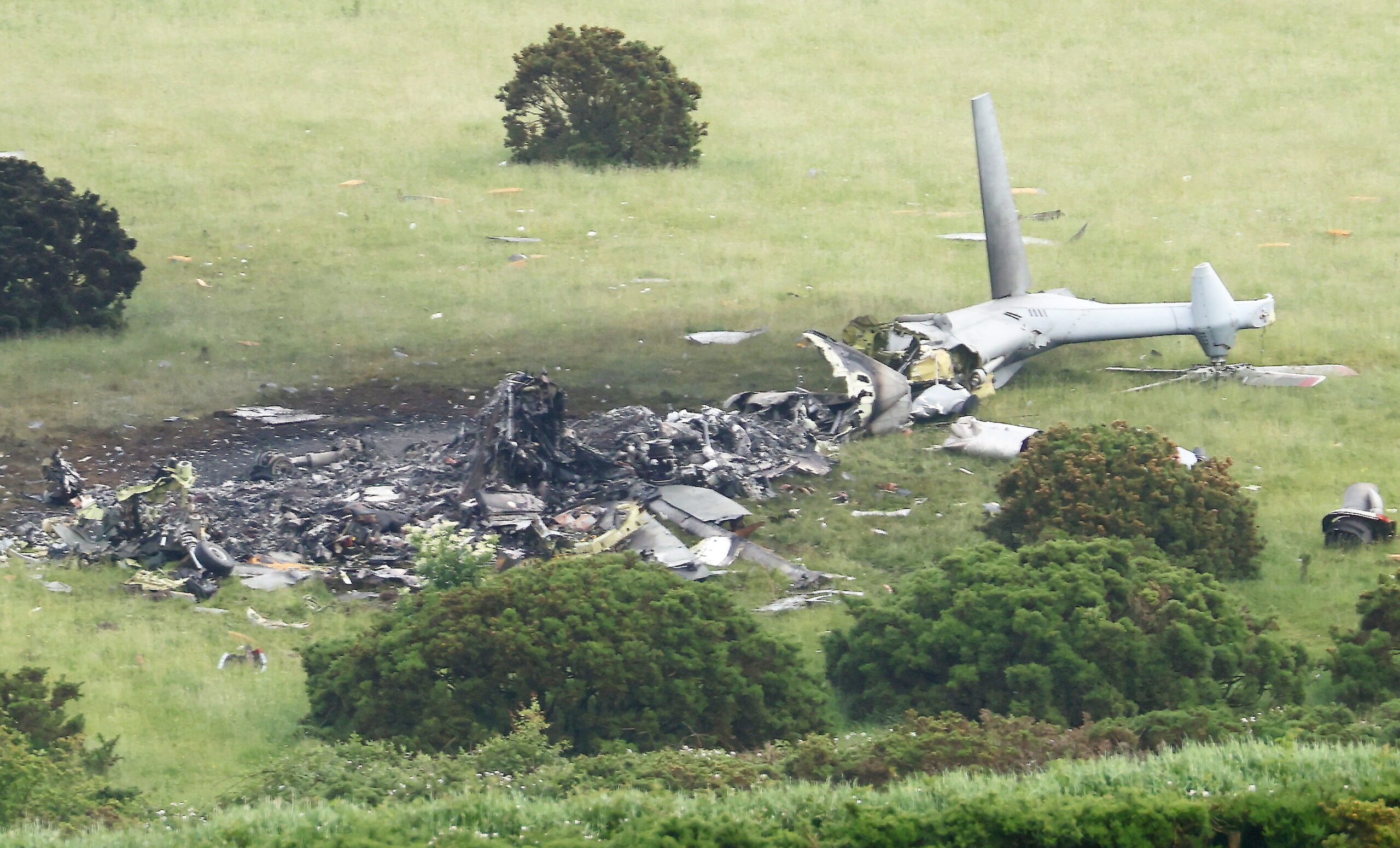 Royal Navy helicopter crashes into a field leaving a devastating scene