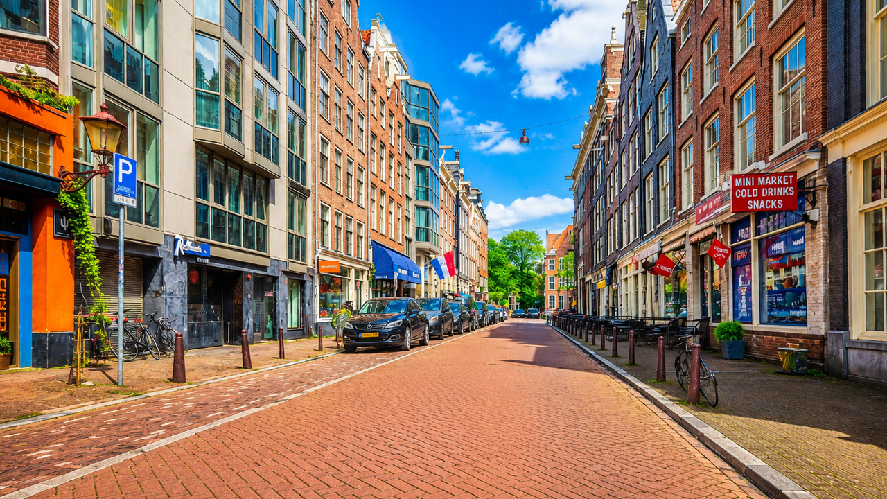 Amsterdam spring streets with colorful shops and canal charm