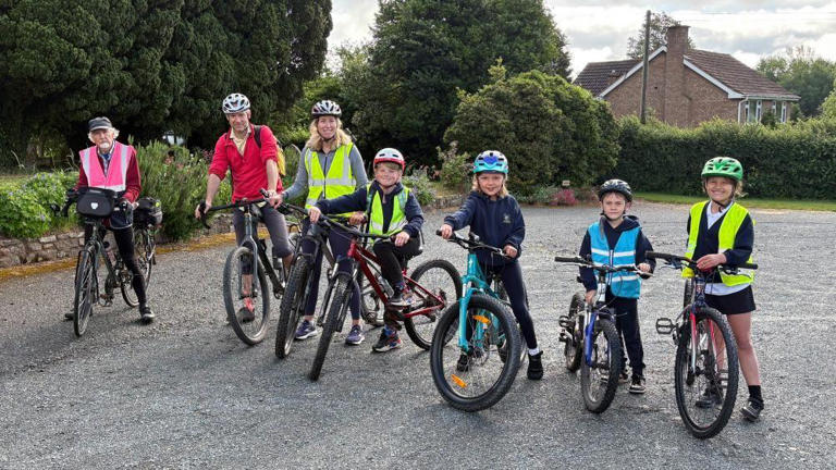 World cycling champion bikes children to school