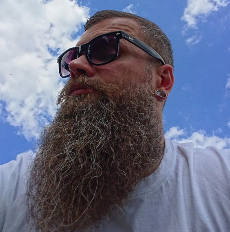 Fan who stopped shaving until Arsenal won league cuts beard after decade