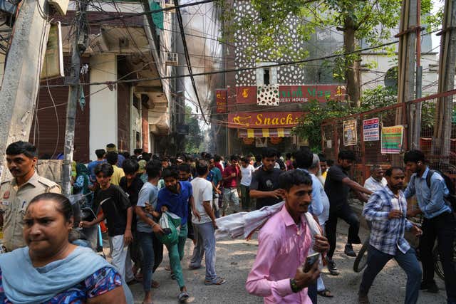 At least 18 people killed as fire sweeps through building in New Delhi