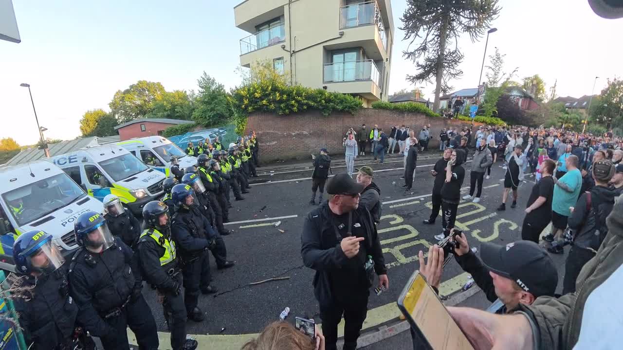 Incredible moment protester shows police his rear end during Henry ...