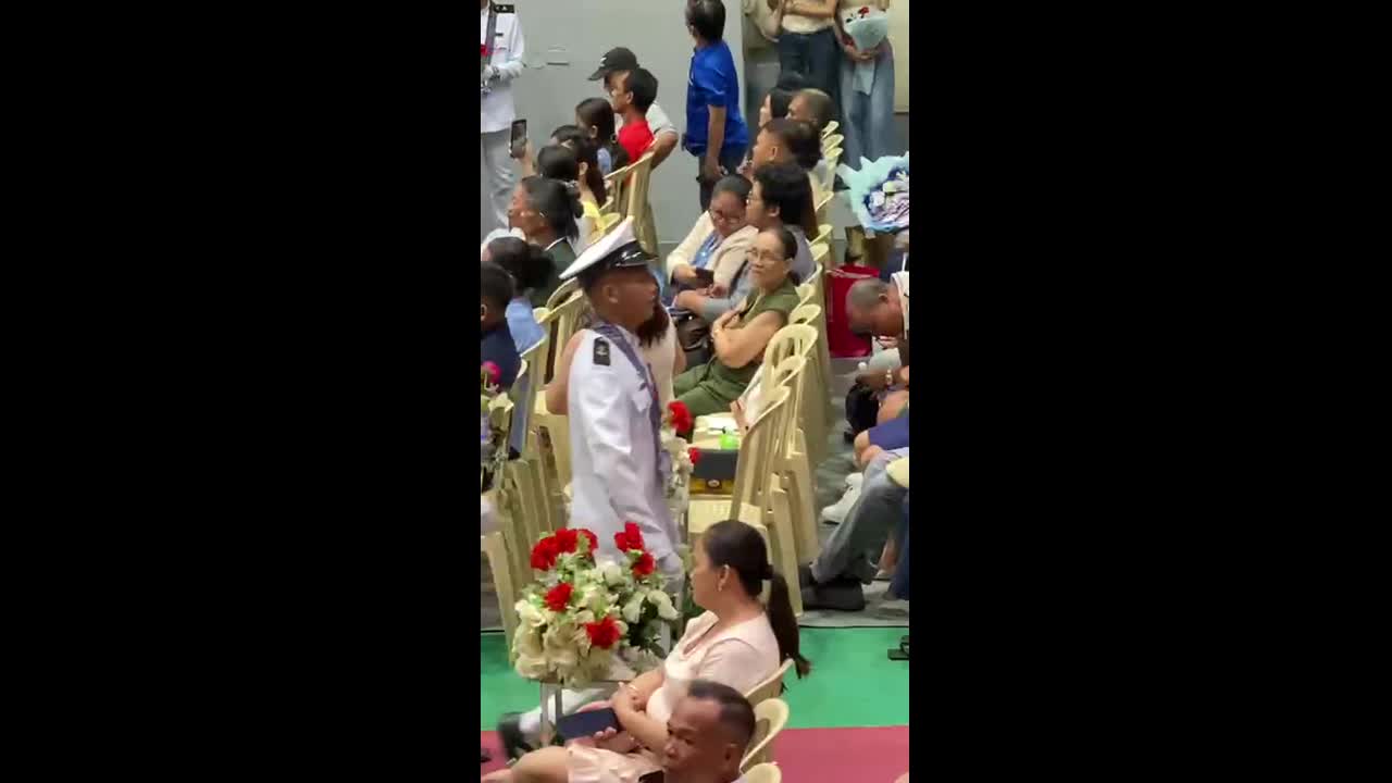 Graduate rushes to parents in emotional hug after receiving diploma