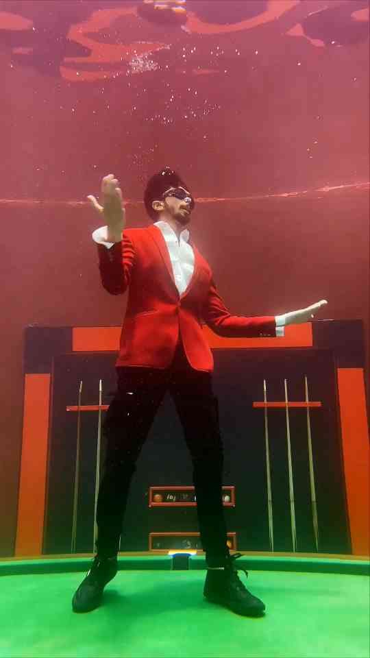 An elegant underwater performance in red