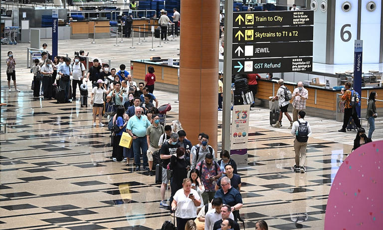 Police recall plane to Changi Airport gate, arrest 3 Chinese nationals ...