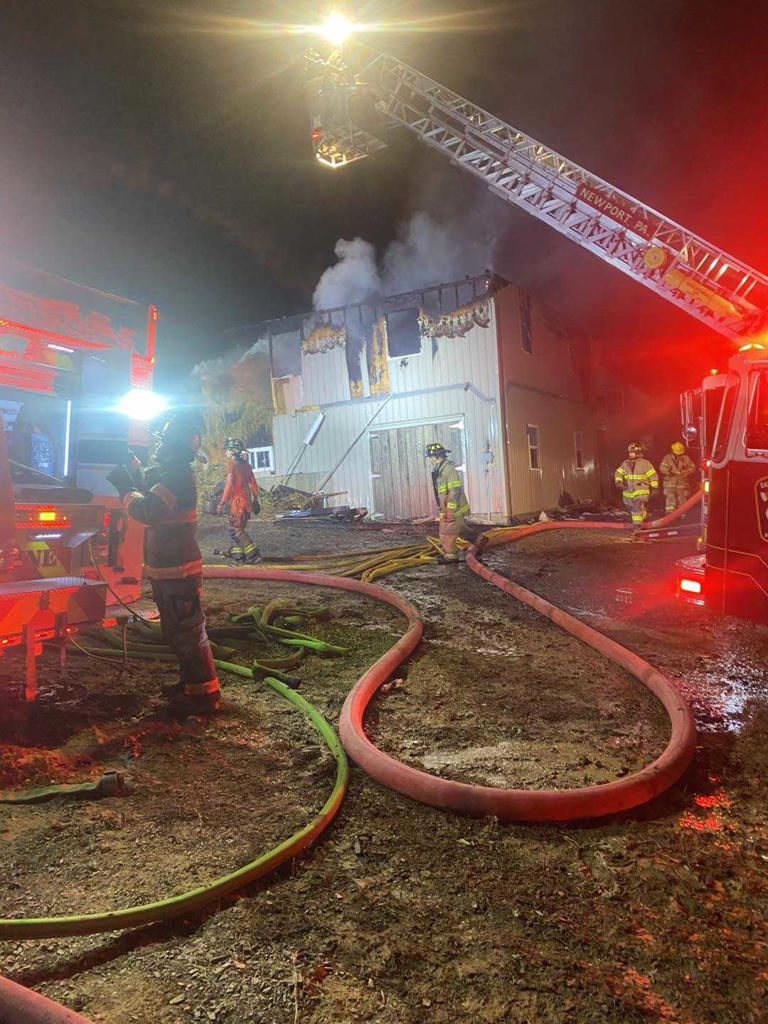 Burning hay bales make barn fire difficult to battle, fire officials say