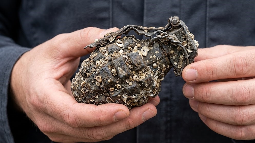 A 3,000-pound magnet pulled up a live grenade - then police said, "Back ...